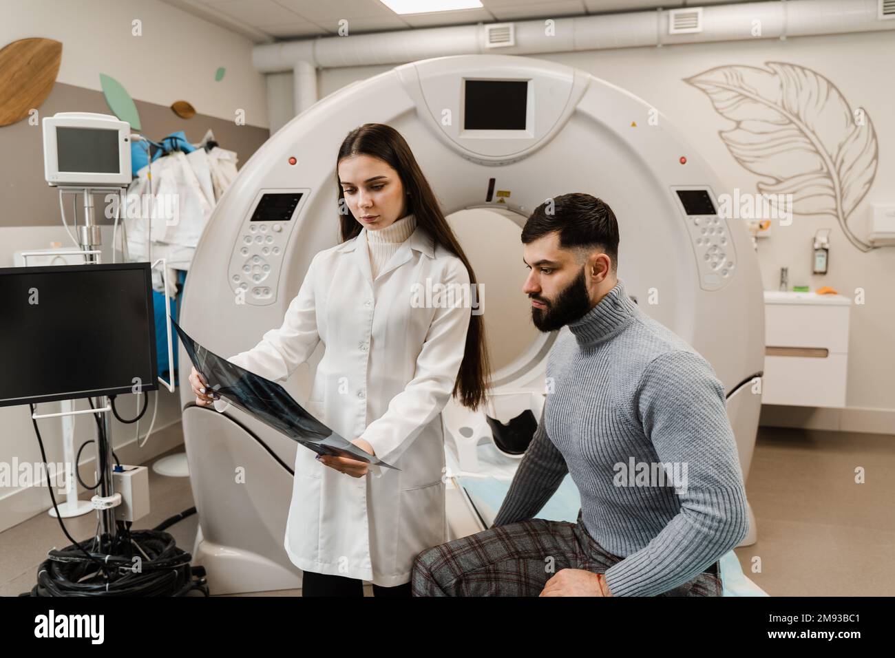 Consultation after MRI examination in medical clinic. MRI Doctor is ...