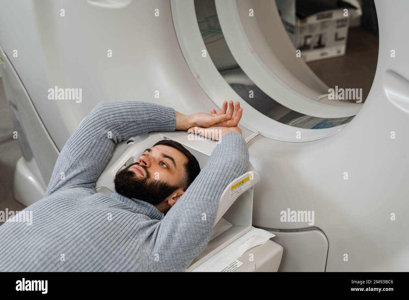 Man is doing computed tomography x-ray examination of abdominal in a CT ...