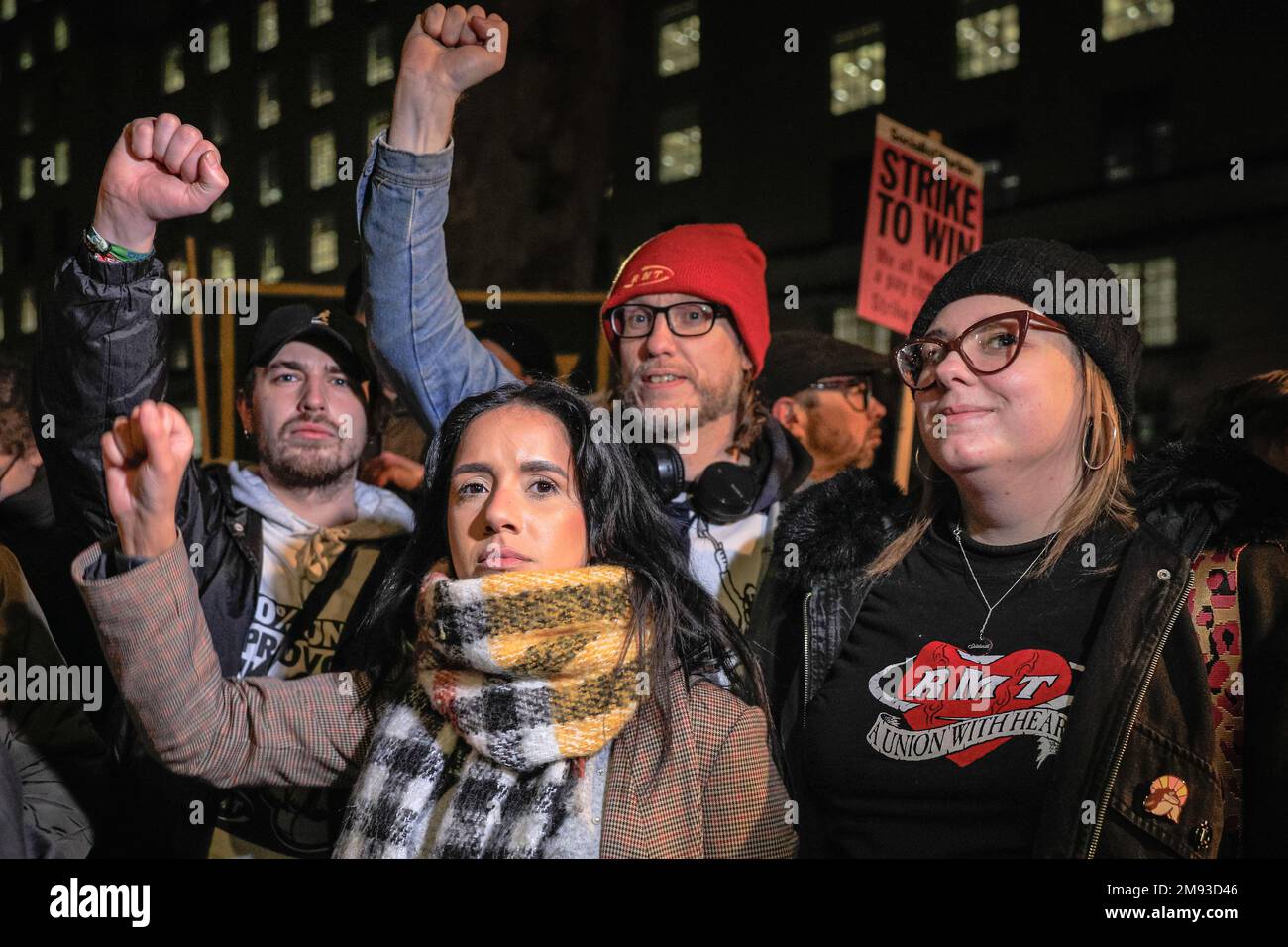 London, UK. 16th Jan, 2023. Angry protesters raise their fists ...