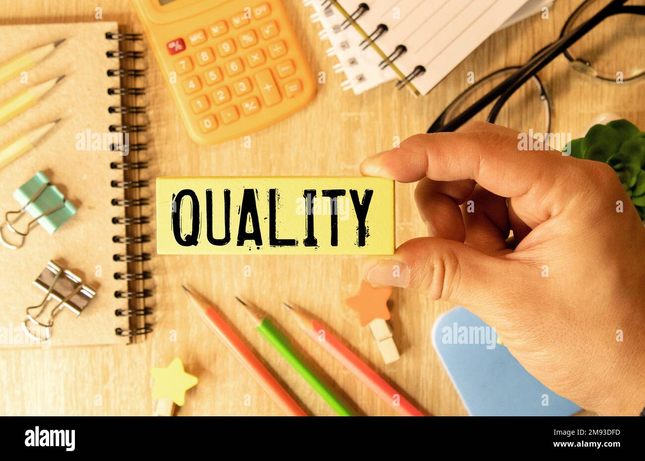 the work environment and the inscription QUALITY in the hands of the ...