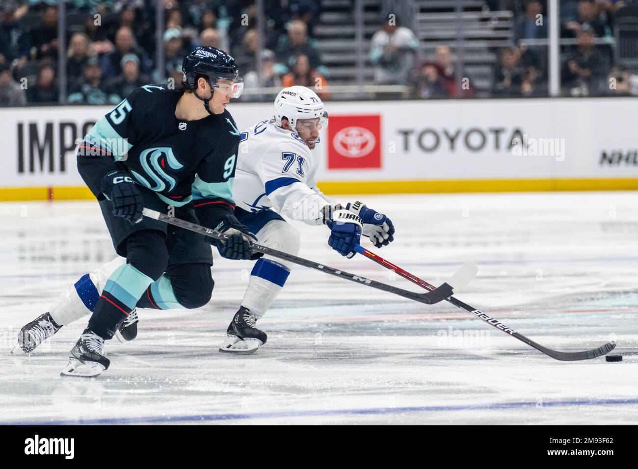 Seattle Kraken forward Andre Burakovsky, left, battles Tampa Bay ...