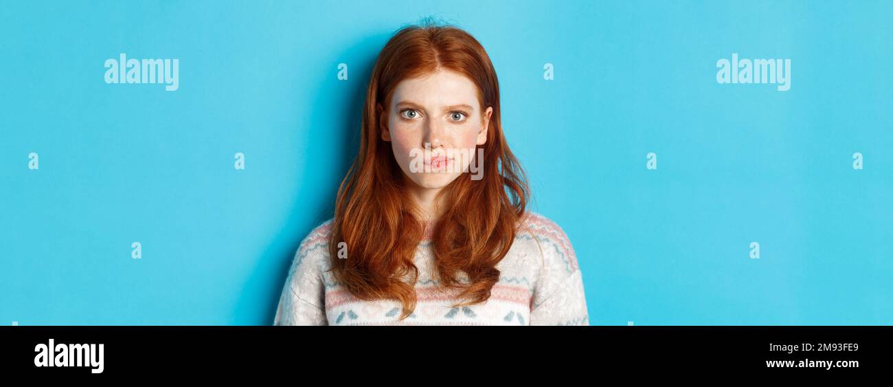 Close-up of serious-looking girl thinking, staring at camera troubled ...