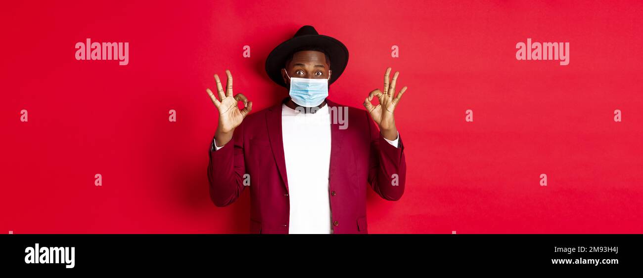 Covid-19 and fashion concept. Stylish african american man in hat and ...