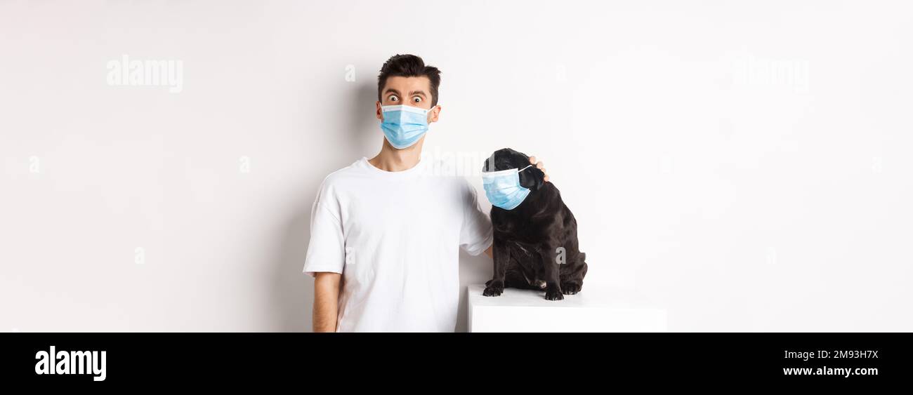 Covid-19, animals and quarantine concept. Image of funny young man and ...