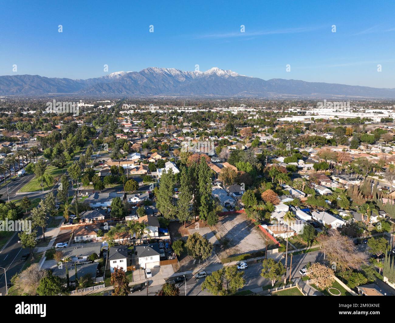 Aerial view of Ontario city in California with mountains in the ...