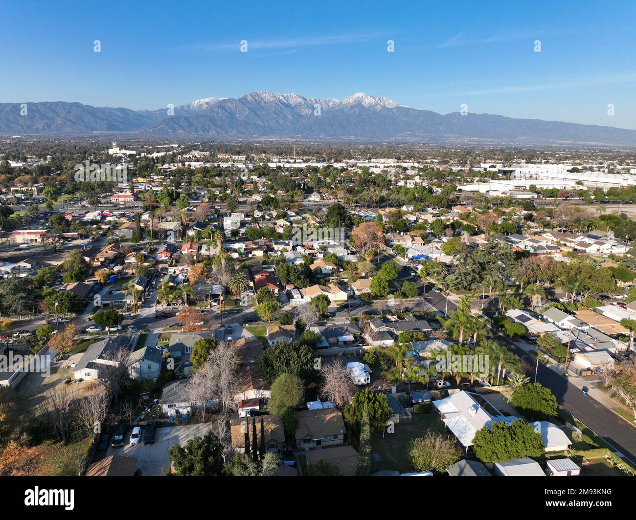 Aerial view of Ontario city in California with mountains in the ...