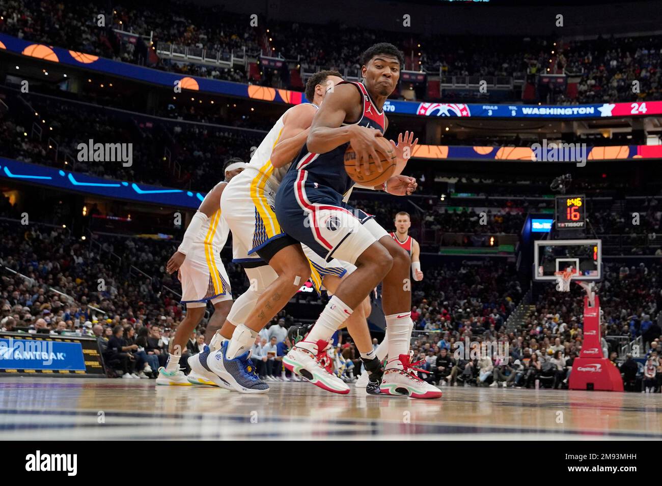 Washington Wizards forward Rui Hachimura, right, moves with the ball as ...