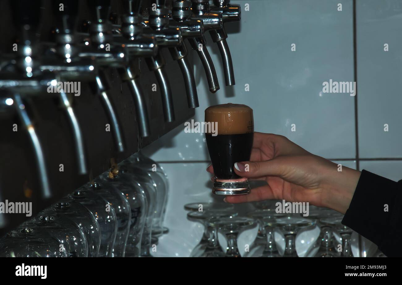 Male hand pouring beer in hi-res stock photography and images - Alamy