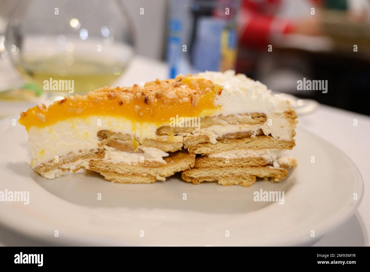 Traditional Portuguese cake with cream, fruits and cookies close up ...