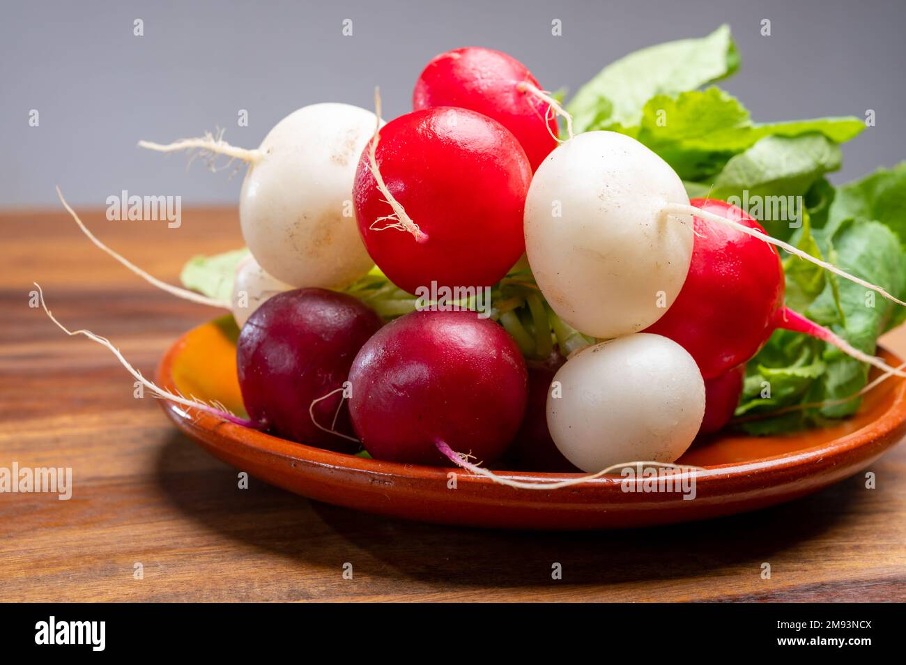 Fresh washed white and red radish roots vegetables ready to eat close ...