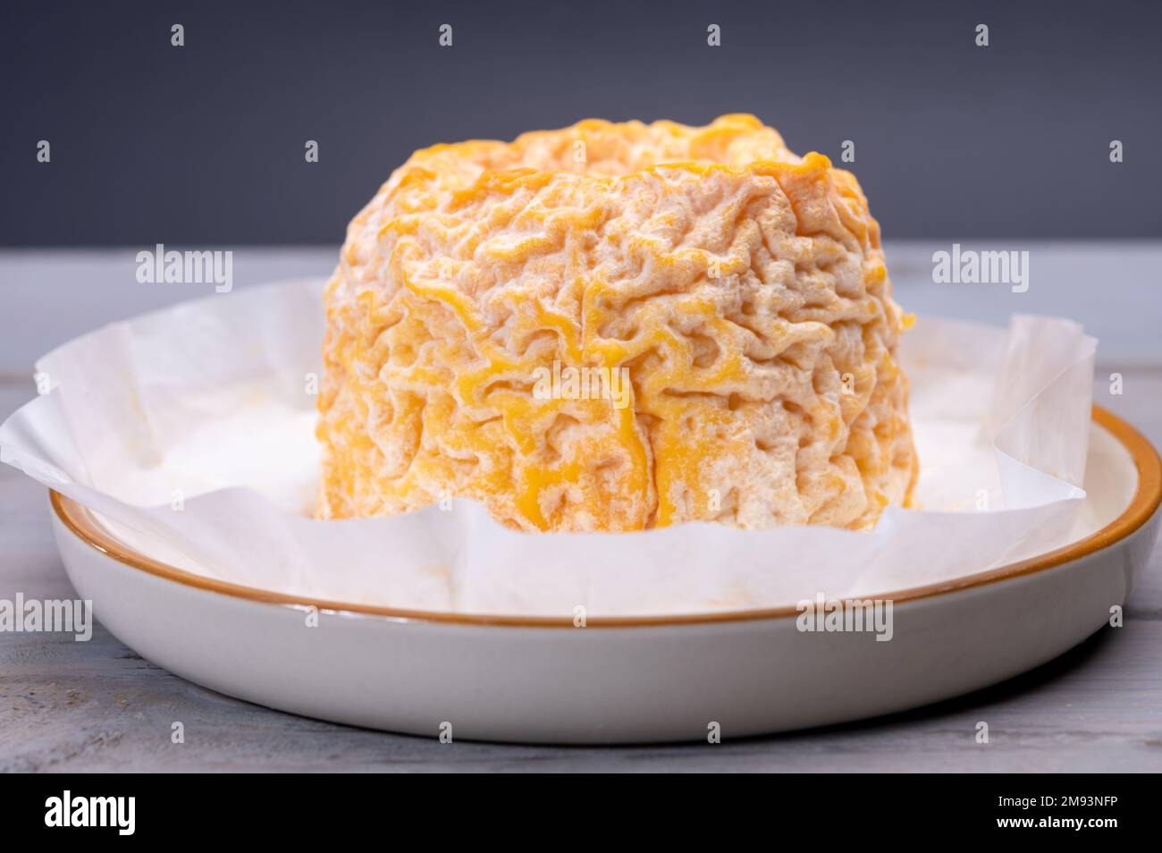 French Langres soft cows crumbly cheese with washed rind structure made ...