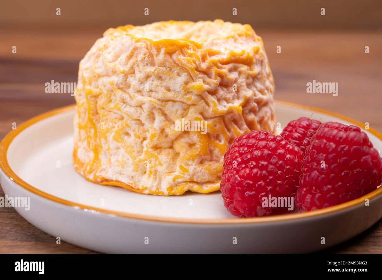 French Langres soft cows crumbly cheese with washed rind structure made ...