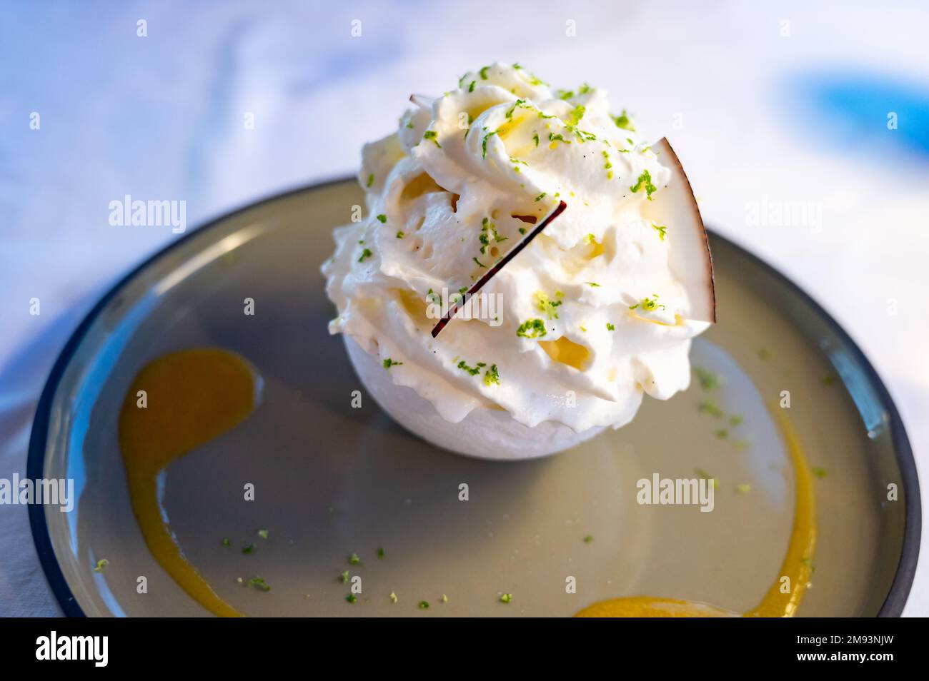 Sweet french dessert, Mango and passion fruit pavlova served in ...