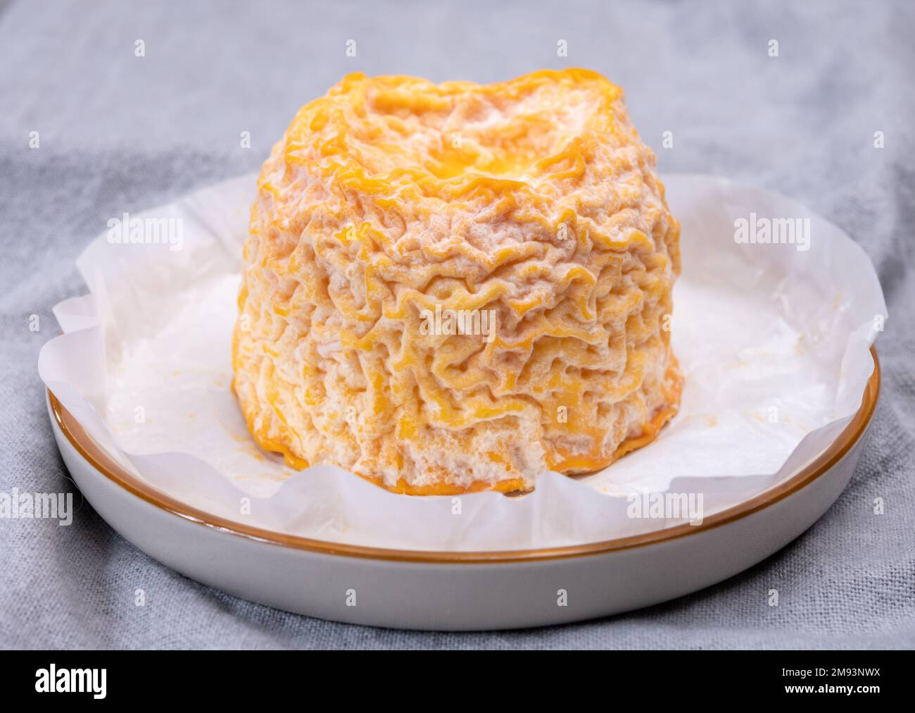 French Langres soft cows crumbly cheese with washed rind structure made ...