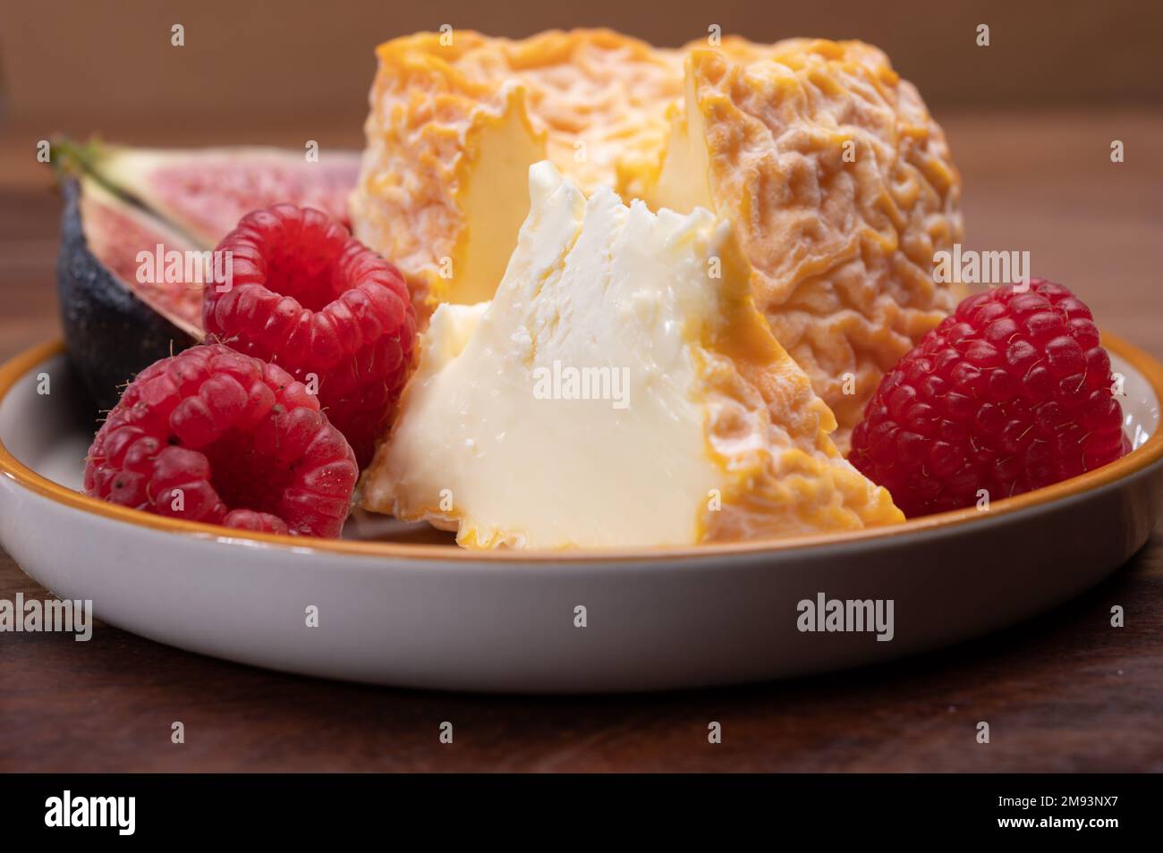 French Langres soft cows crumbly cheese with washed rind structure made ...