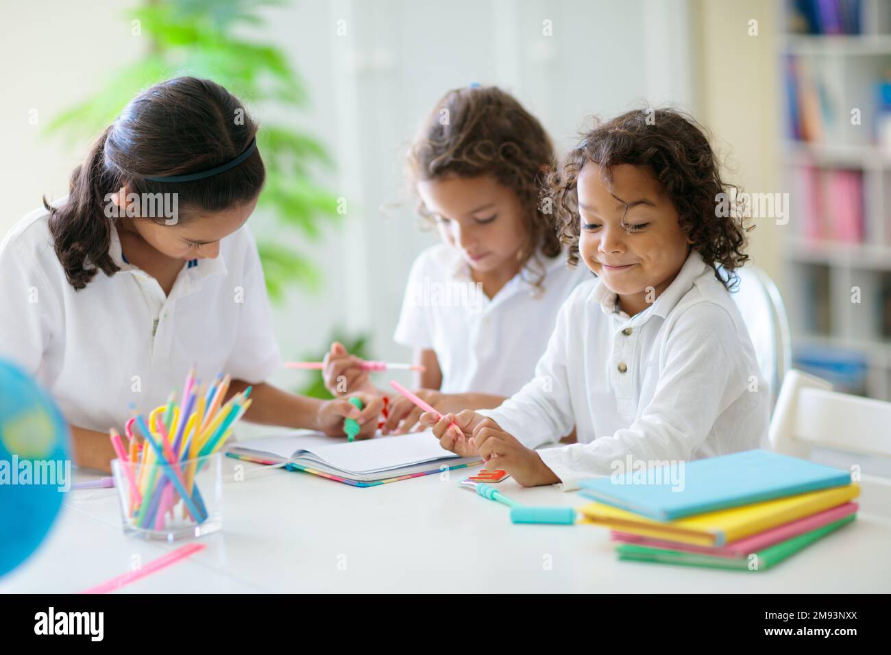 Kids go back to school. Interracial group of children of mixed age in ...