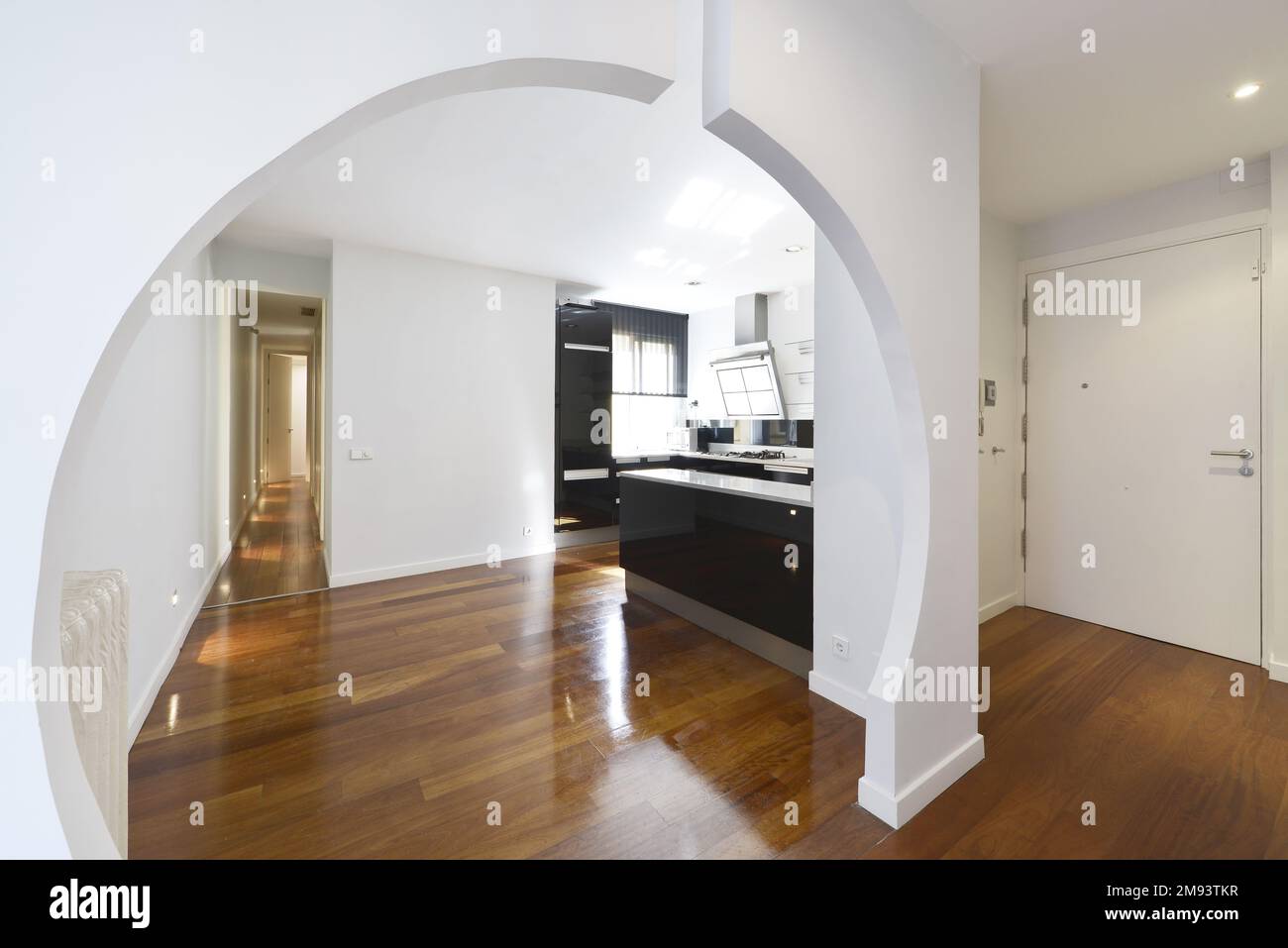 Living room of a house with access to an open kitchen with a wide ...