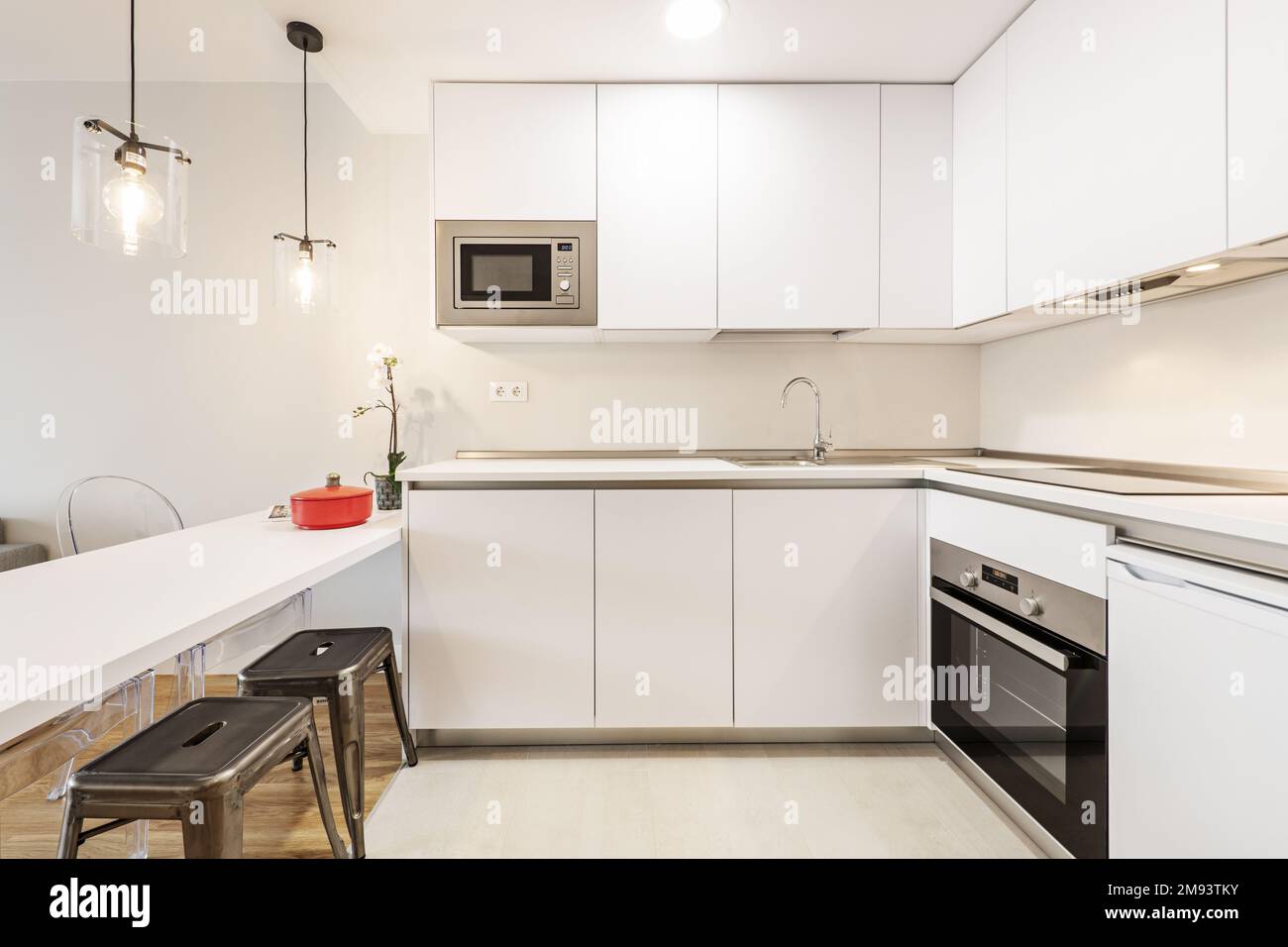 Kitchen of a loft-style house with an open kitchen with plain white ...