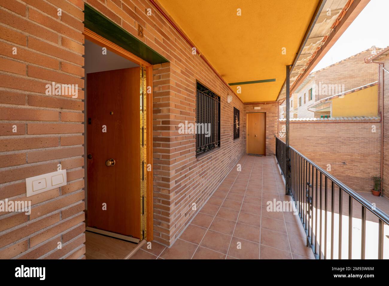 Corridors of an access building to independent houses with metal ...