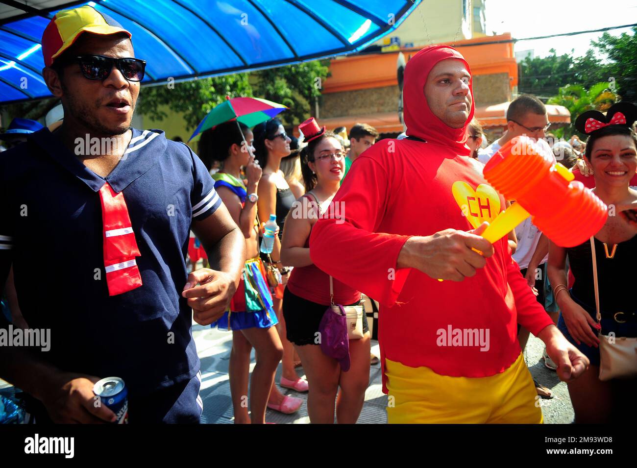 People gather wearing costumes for brazilian carnival celebration ...
