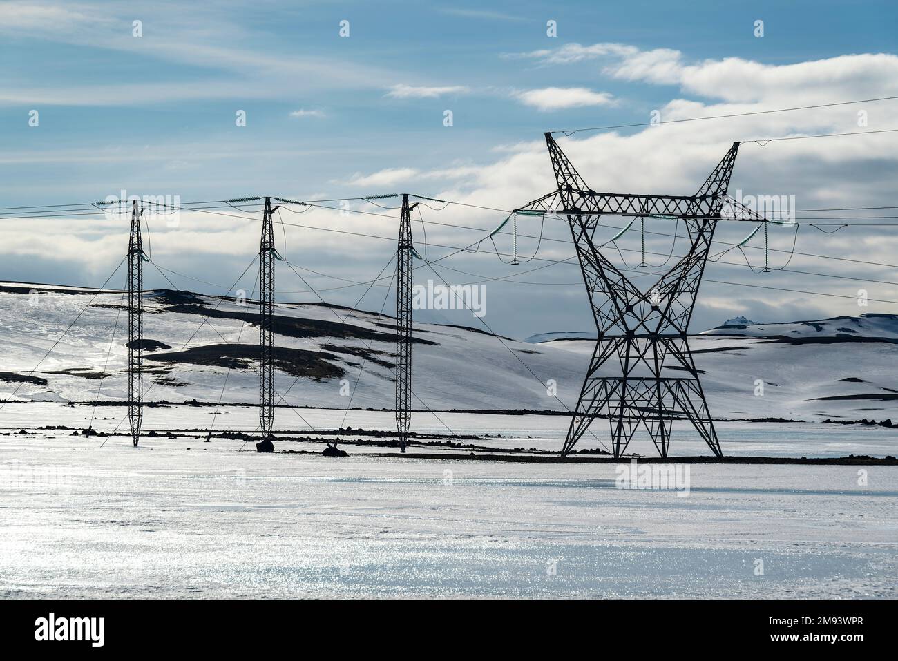 Typical Icelandic transmission towers in a frosty winter landscape in ...