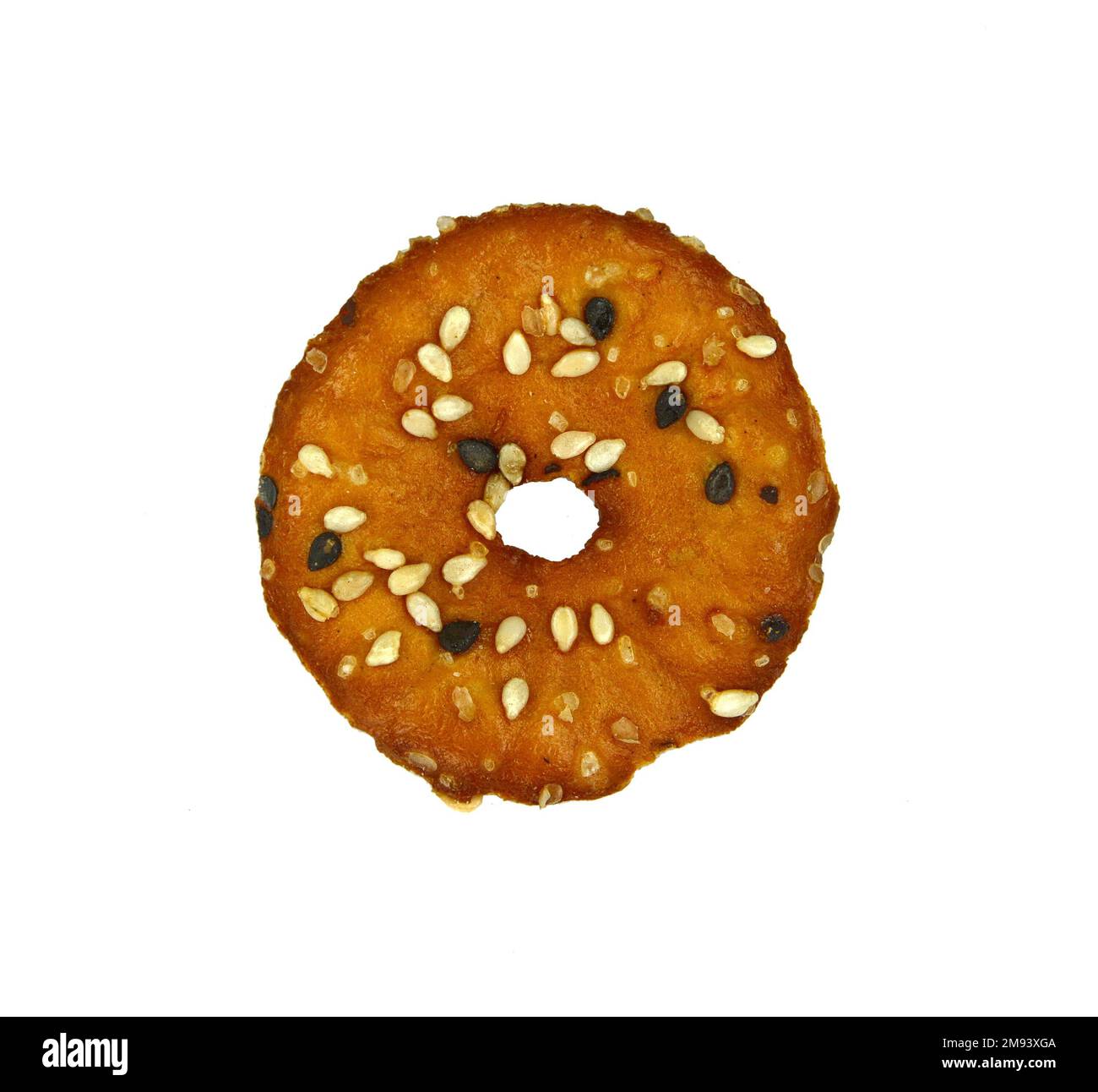 Salted round pretzels with black and white sesame isolated on white ...