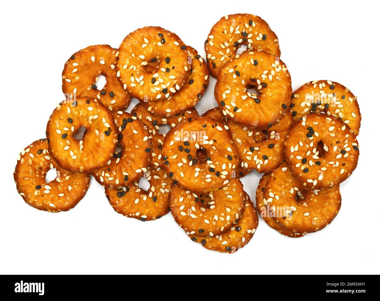 Salted round pretzels with black and white sesame isolated on white ...
