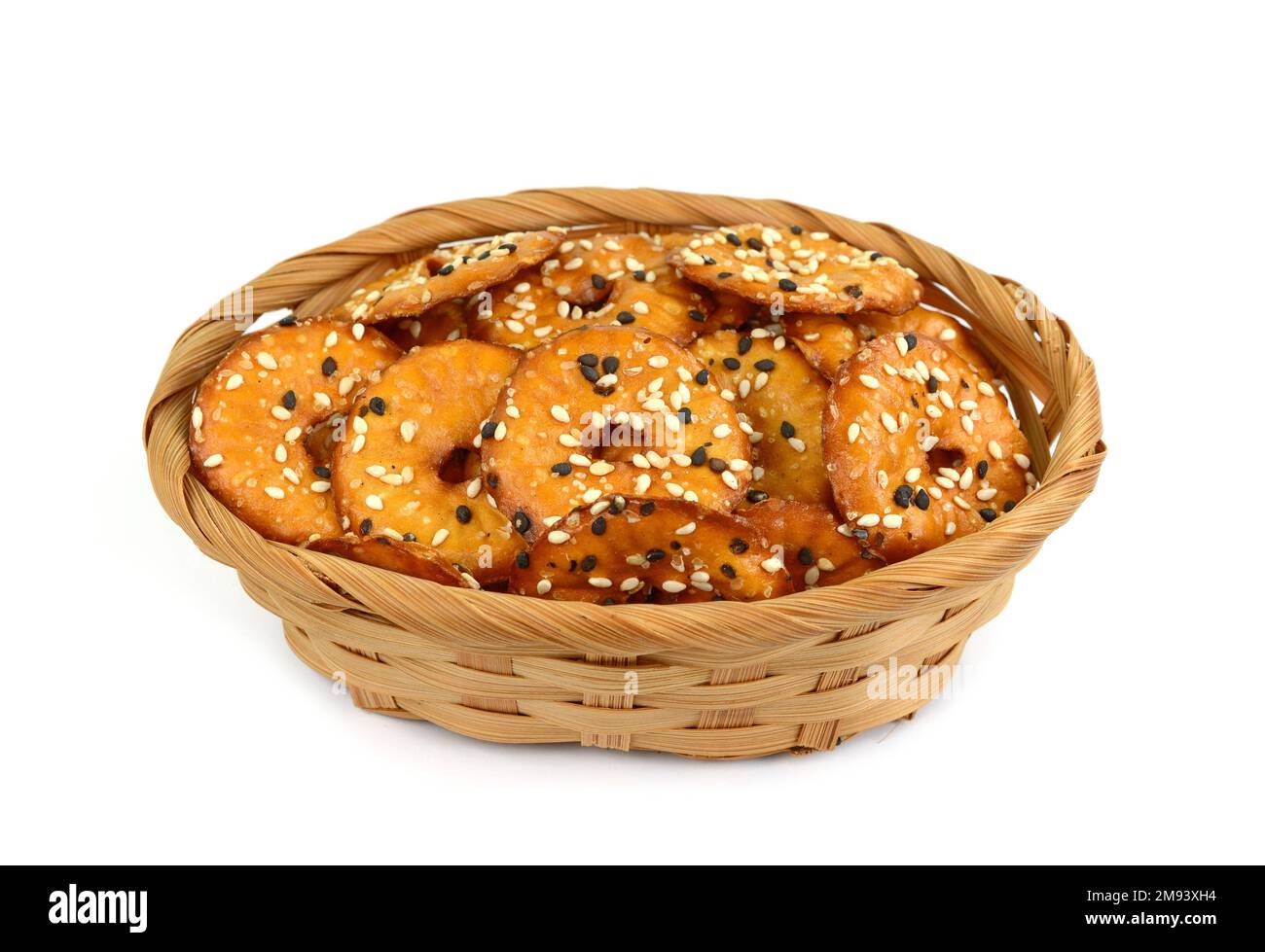 Salted round pretzels with black and white sesame isolated on white ...