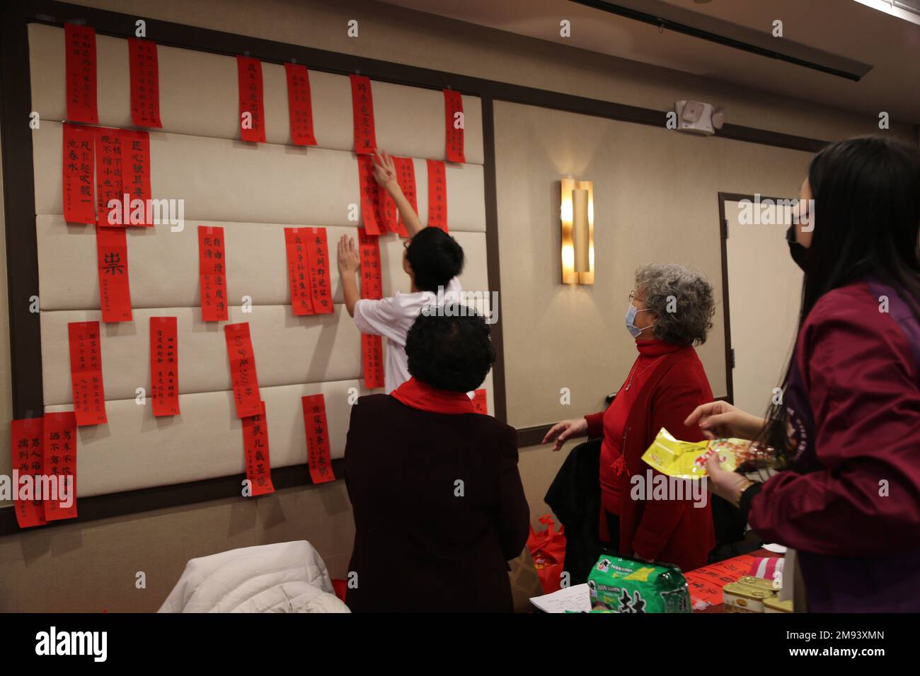 New York, USA. 15th Jan, 2023. A child tries to fetch a traditional ...