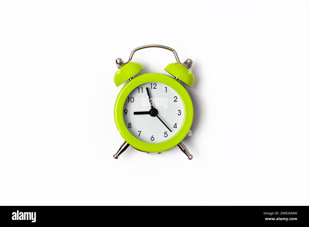 Beautiful lime green metal alarm clock isolated on white background ...