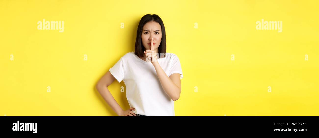 Beauty and fashion concept. Angry and bossy asian girl telling to be ...