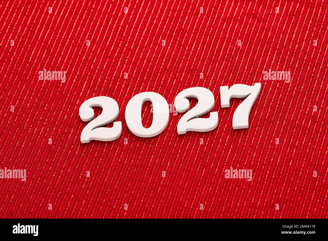 Happy new year 2027 in white letters on red background Stock Photo - Alamy