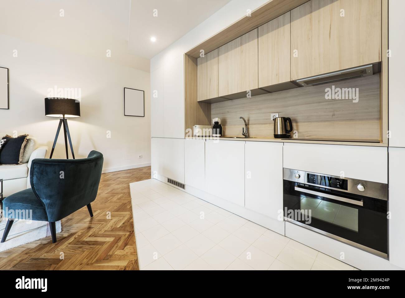 loft-style vacation rental house with a kitchen open to the living room ...