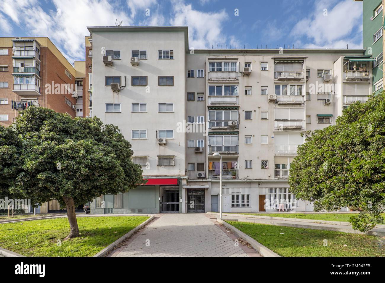 Facades of residential buildings of modest construction in a street ...