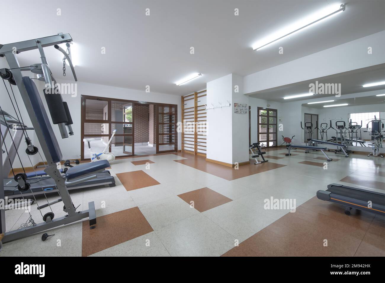 A community gym located in a room on the ground floor of a building ...