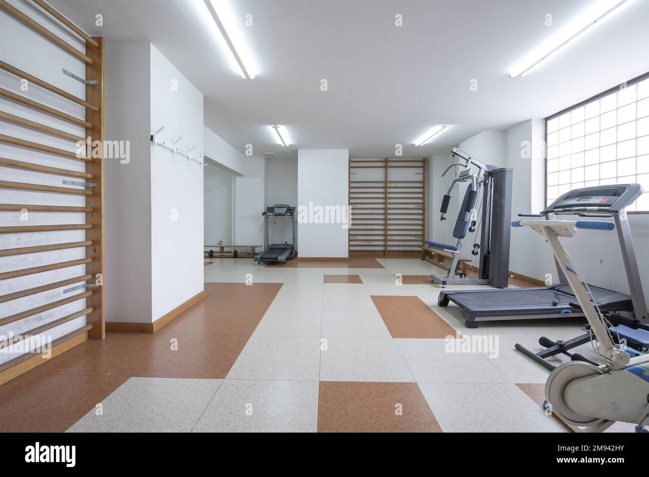 A community gym located in a room on the ground floor of a building ...