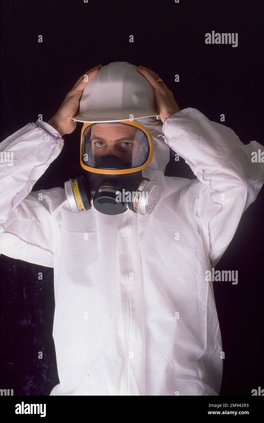 Person in a white hazmat suit with helmet face shield and mask Stock ...