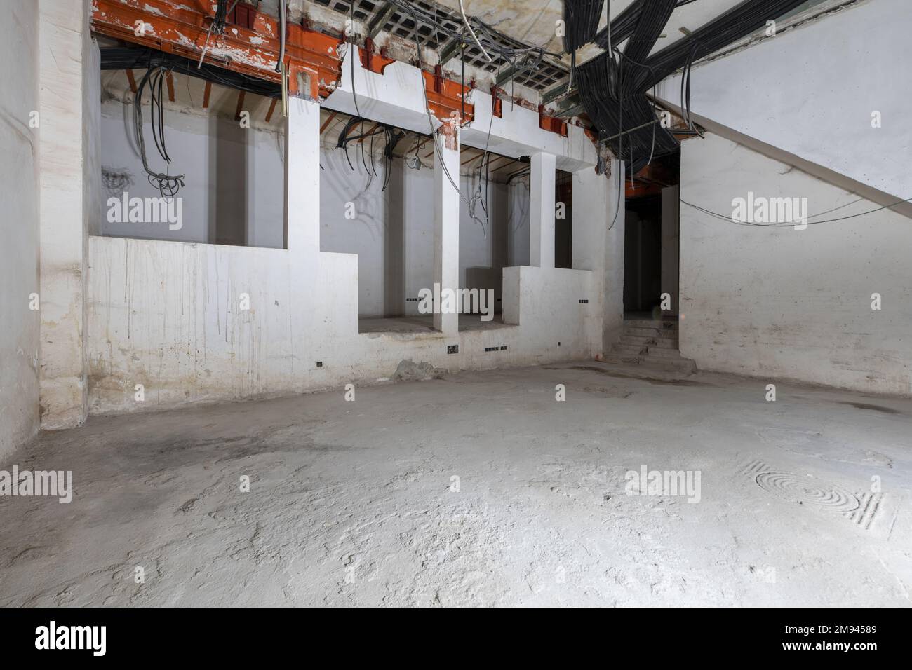 A place under construction with raw walls and corrugated pipes to ...