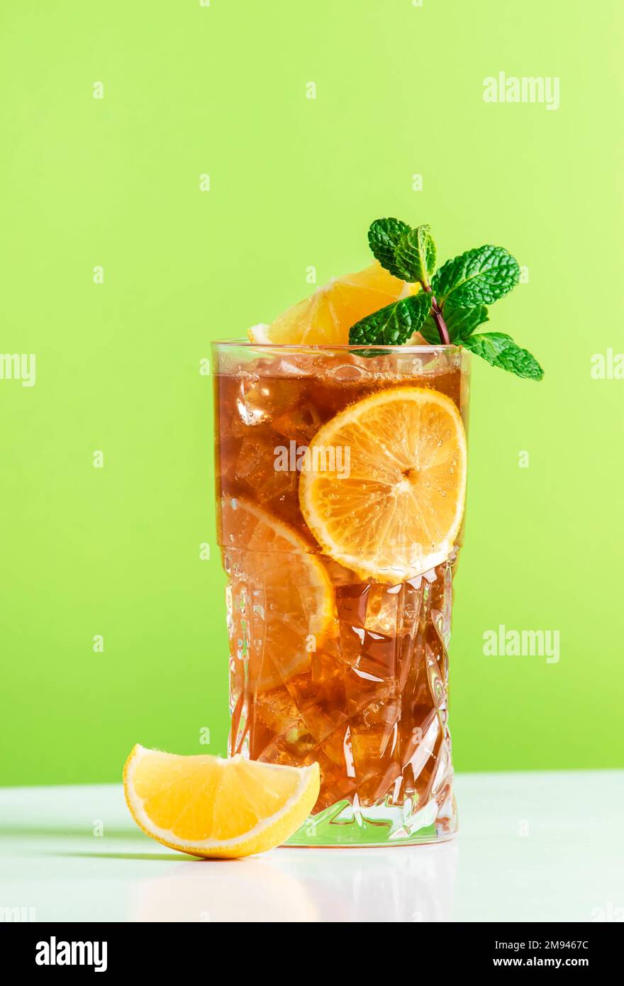 Long Island ice tea cocktail with vodka, rum, tequila, gin, liquor, lemon juice, cola and ice ...