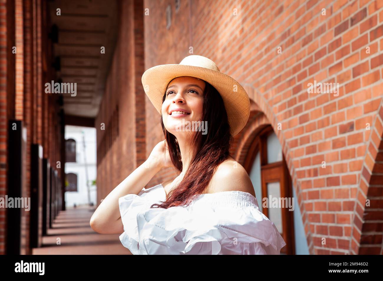 Beautiful young woman wearing a traditional hat typical of the small ...