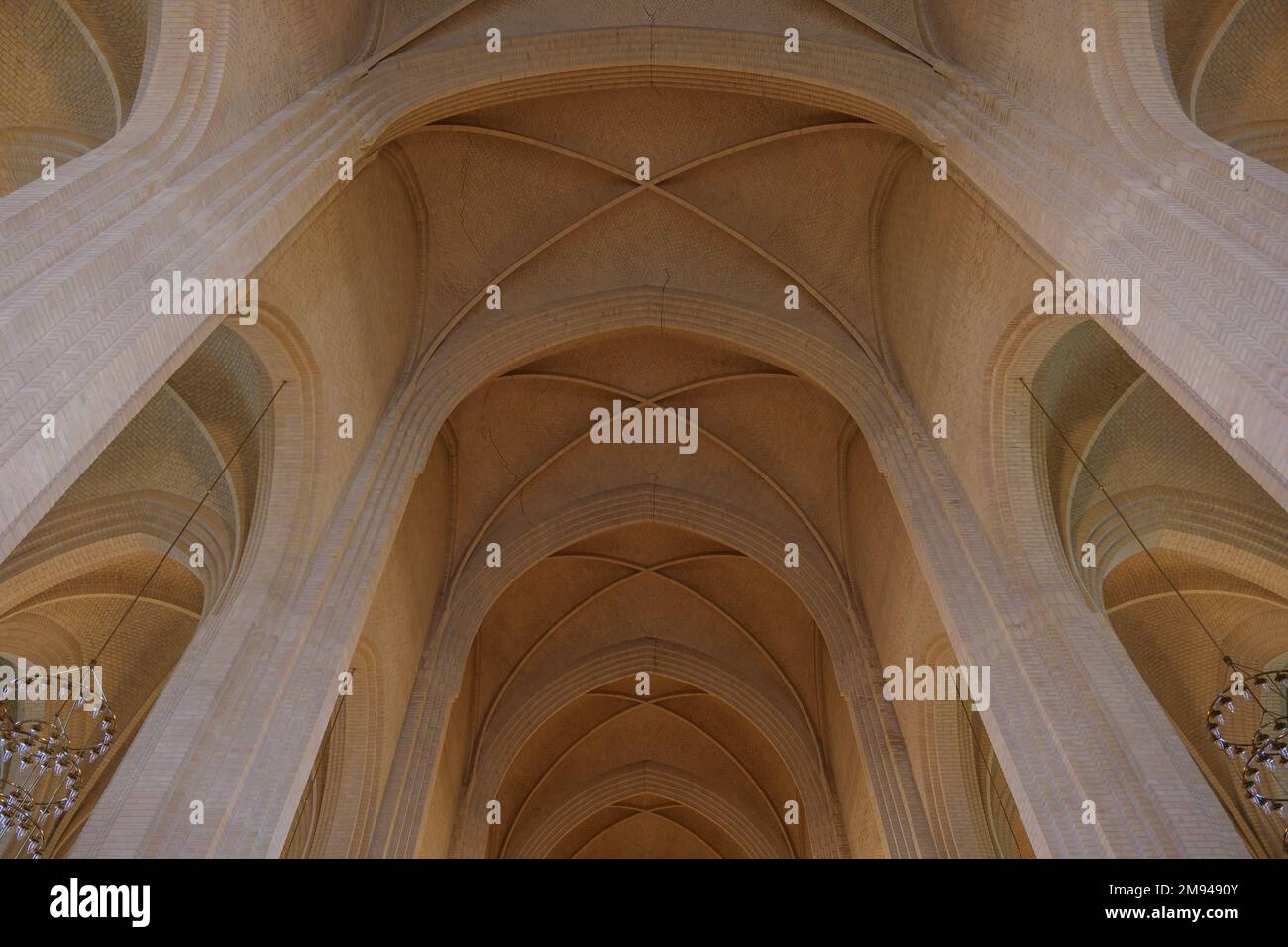 Detail of cream brick vault, arch, rib wall, column and clerestory ...