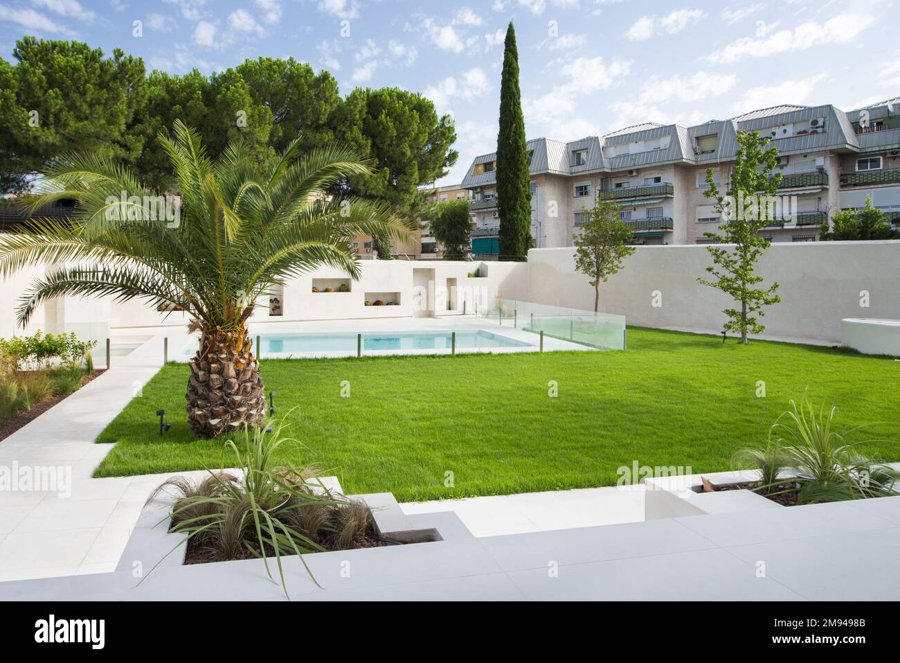 Beautiful swimming pool of a luxury detached house with marble tiles ...