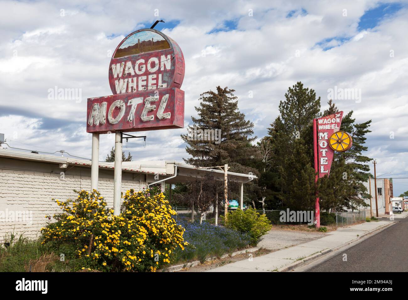 Vintage neon signs of the Wagon Wheel Motel in Wells, Nevada still stand along the former route ...