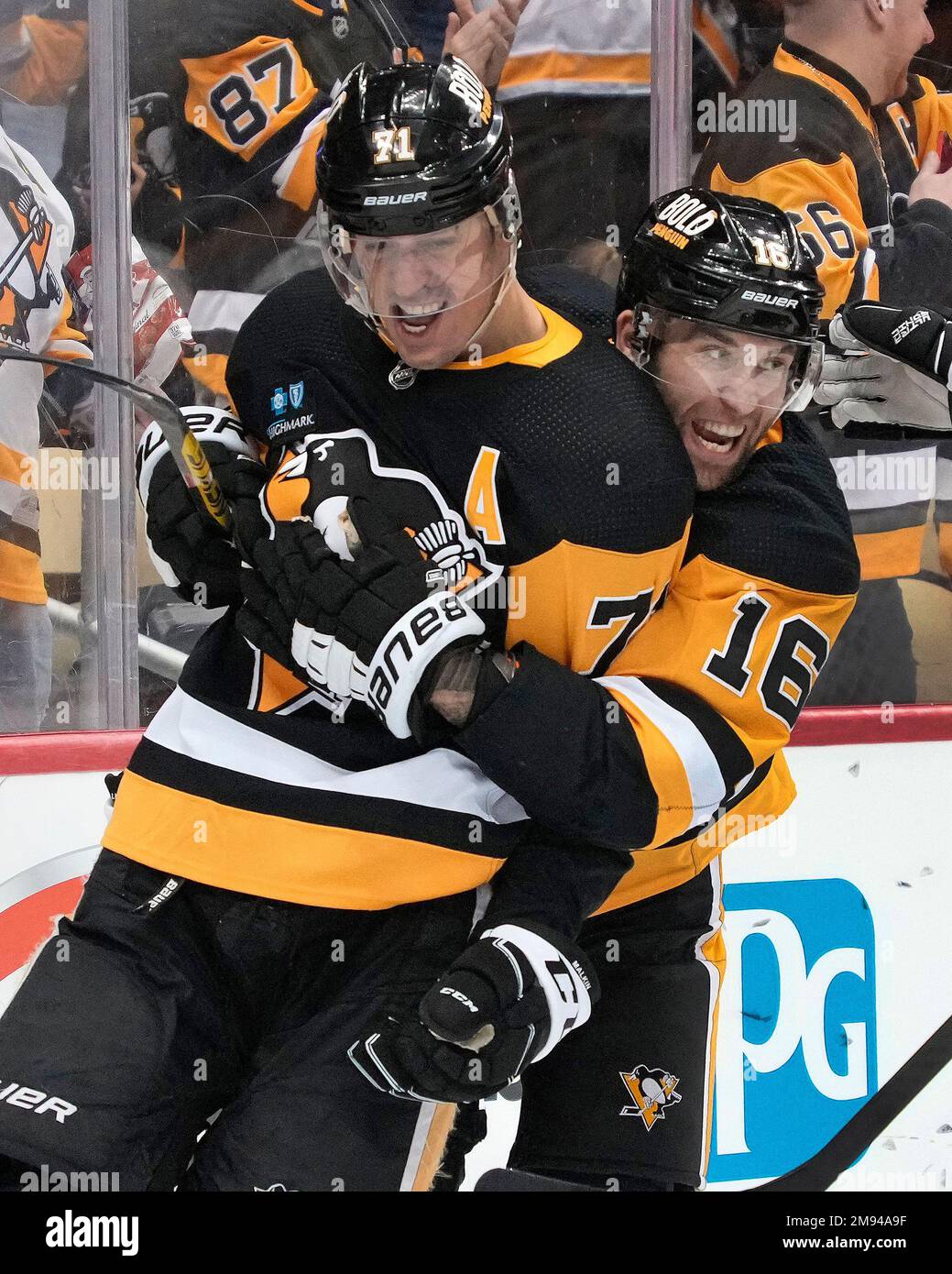 Pittsburgh Penguins' Evgeni Malkin (71) celebrates his goal with Jason ...