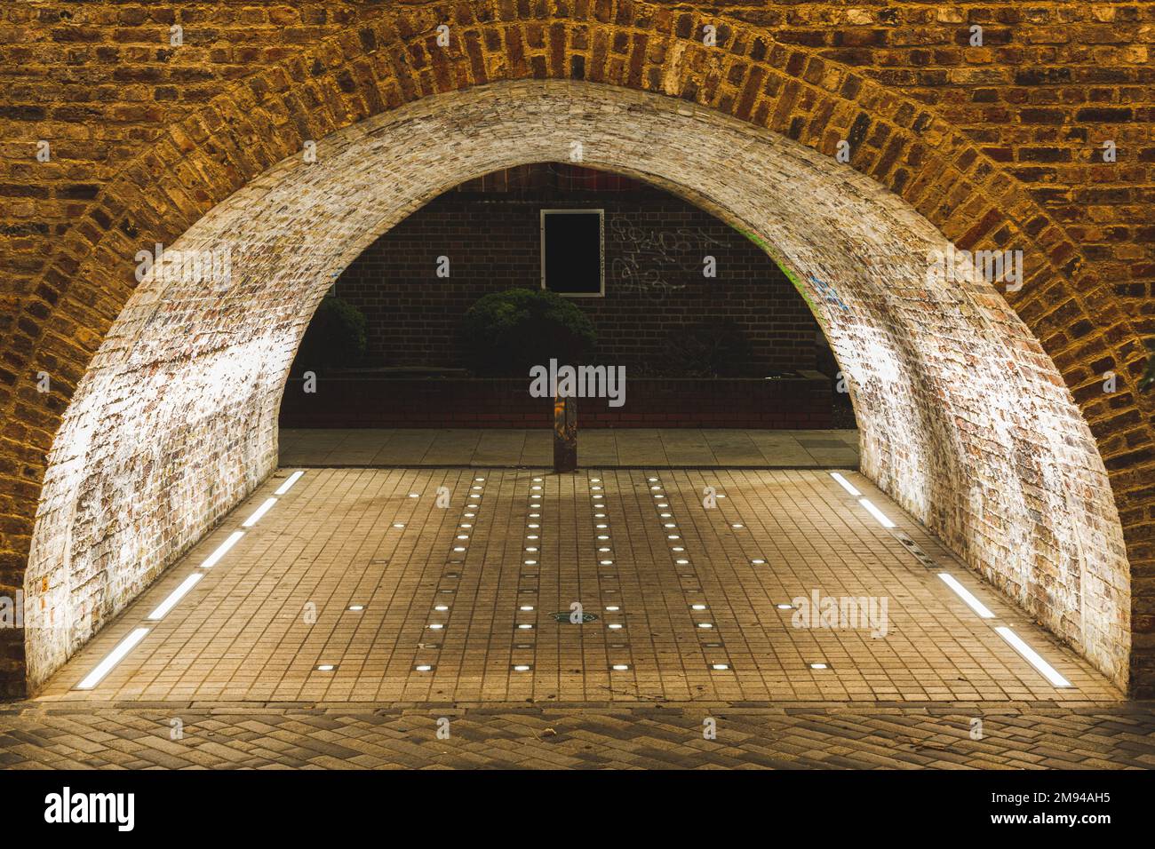 Railway Arch with Lights Stock Photo - Alamy