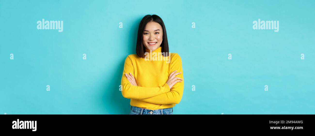 Confident and stylish asian woman cross arms on chest and smiling ...