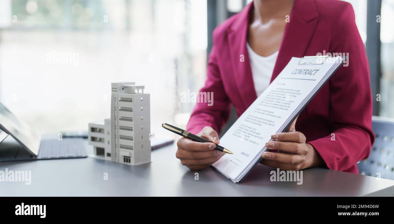 Business woman or Real Estate agent explain signing agreement for ...