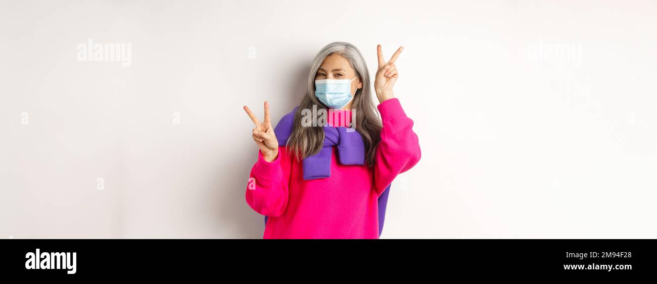 Covid, pandemic and social distancing concept. Cheerful and stylish ...