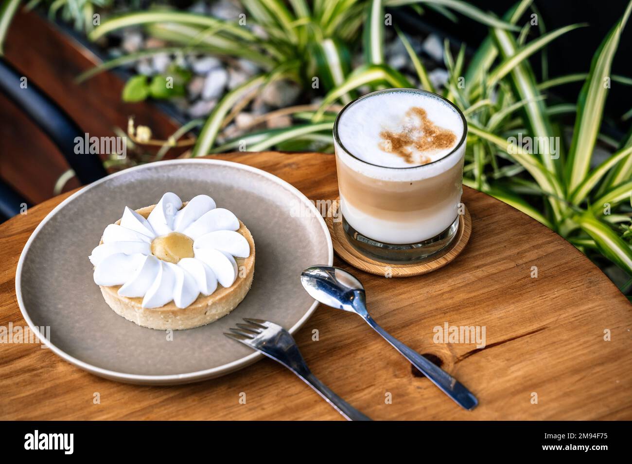 Coffee and cake on a cafe table outside. Morning, drink, good mood ...