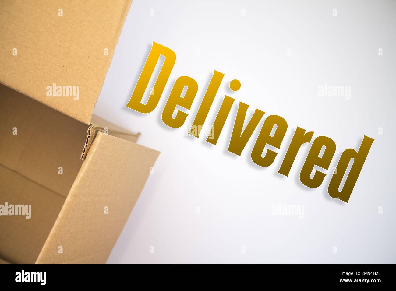 Delivered word with cardboard box. Brown folded card box Stock Photo ...